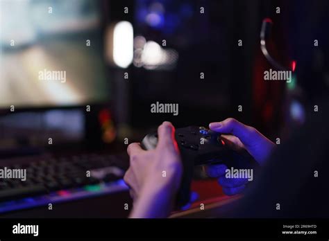 Hand Of Female Cyber Hacker Gamer Holding Controller Joystick To Playing Games On Computer Stock
