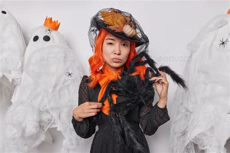 Serious Mysterious Woman Holds Big Spooky Spider Has Orange Hair Wears