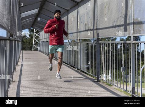 Shot Of A Running Man In The Street Stock Photo Alamy