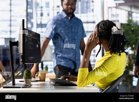 Programmer Doing Software Debugging Asking For Help From Coworker