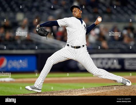 New York Yankees Relief Pitcher Aroldis Chapman Winds Up In A Baseball