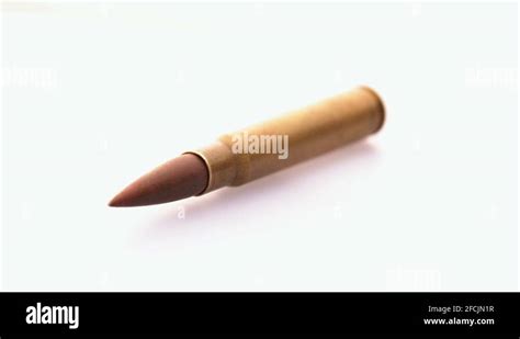 Sniper Rifle Bullet With Shell Casing On A White Background Rotating