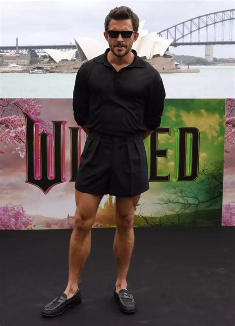Jonathan Bailey Shows Off Super Toned And Tan Legs In Short Shorts At Wicked Premiere In