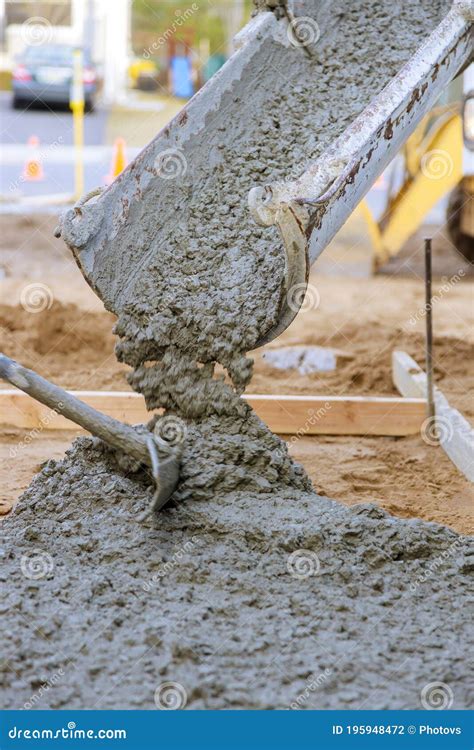 Concrete Truck With Pouring Cement During To Residential Street