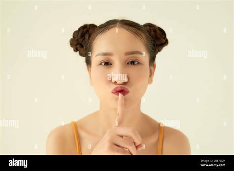 Keep In Secret Portrait Of Playful Positive Asian Teen Girl With Buns