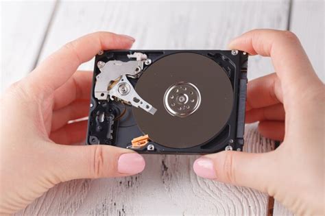 Premium Photo Female With A Hard Disk Hdd In The Hands