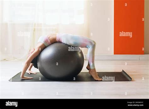 An Attractive Woman Leading A Healthy Lifestyle And Practicing Yoga