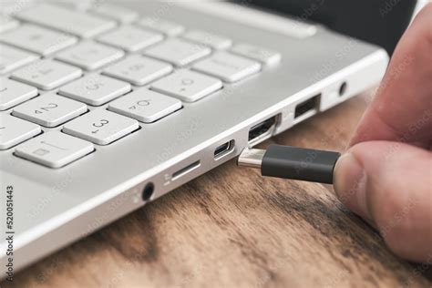 Insert Usb Type C Plug Into Usb Port On Laptop Computer Stock 写真 Adobe Stock