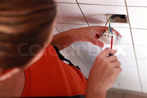 Woman Fixing A Plug Stock Image Colourbox