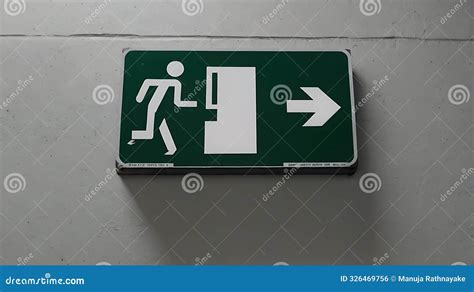 Exit Sign In Building Emergency Exit Indicator With Directional Arrow In Commercial Space