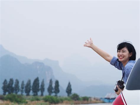 Premium Photo Happy Woman With Camera Reaching Sky