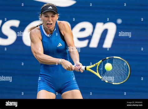 Caroline Wozniacki Of Denmark Returns Ball During 3rd Round Against