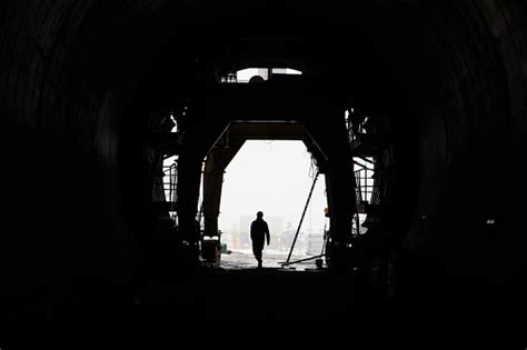 The Silhouette Of A Person In A Highspeed Railway Tunnel Under