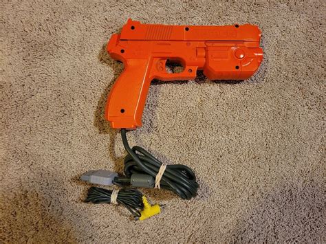 Playstation 1 Namco Guncon NPC 103 Orange Light Gun Game Controller PS1 Values MAVIN