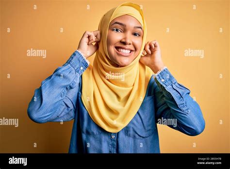 Young Beautiful Woman With Curly Hair Wearing Arab Traditional Hijab