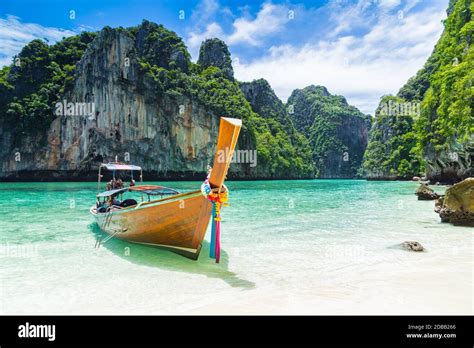 Thai Traditional Wooden Longtail Boat And Beautiful Beach In Phuket