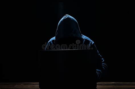 A Hacker With Laptop Sits At A Table And Abstract Binary Code Business Life Threat Virtual