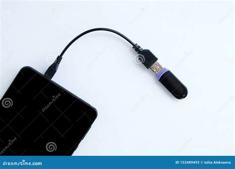 Transfer Digital Data The Cable Is Connected To The Smartphone And USB Flash Drive Stock Image
