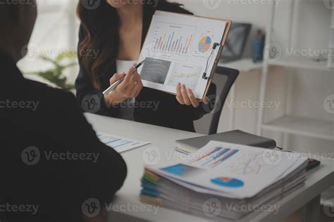 Business Professionals Group Of Young Confident Business People Analyzing Data Using Computer