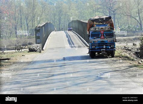 A Colourfully Painted Vehicle Crosses A Bridge In The Countryside