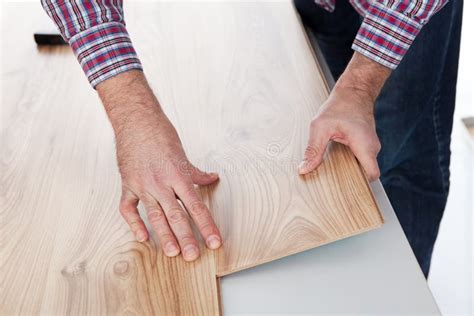 Worker Assembling Laminate Floor Using A Hammer Stock Image Image Of
