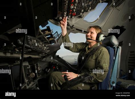 A U S Air Force Pilot Conducts Her Preflight Checklist During Engine