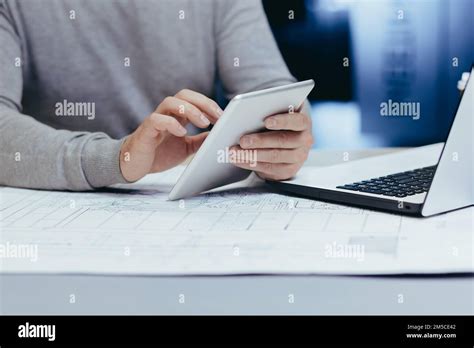 Close Up Photo Of Hands Of Male Designer Architect Working With Tablet Computer Inside Modern