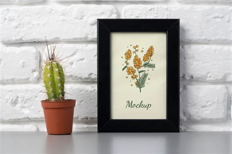 벽돌 벽에 매달린 프레임 모형 프리미엄 Psd 파일