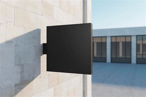 콘크리트 건물에 있는 빈 사각형 검은색 마개 햇빛 배경이 있는 밝은 도시 광고 펍 카페 또는 레스토랑 배너 3d 렌더링 모의 프리미엄 사진