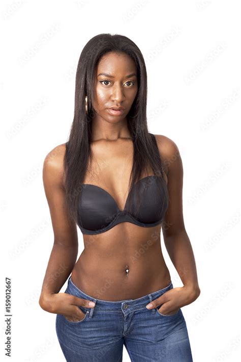 Young African American Woman Posing Wearing Jeans And Her Bra Stock