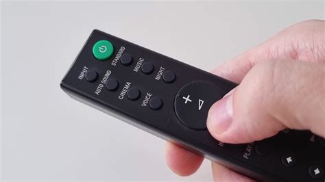 Premium Stock Video Pressing The Buttons For Volume Up And Down On The Remote Control To