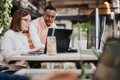 Diverse Business Team Collaborates In Corporate Office Focusing On Data Analysis And Project