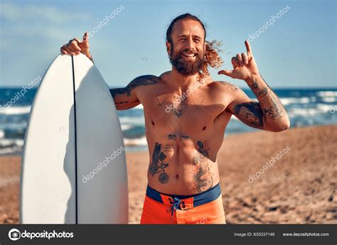 Surfer Dude Tattoos Young Surfer Man With Long Hair Dressed In Wetsuit