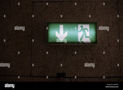 Color Image Of A Green Exit Sign Above A Door Stock Photo Alamy