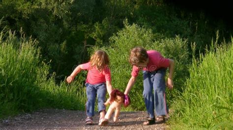 Brother And Sister Holds Doll And Runs To Camera Stock Video Video Of