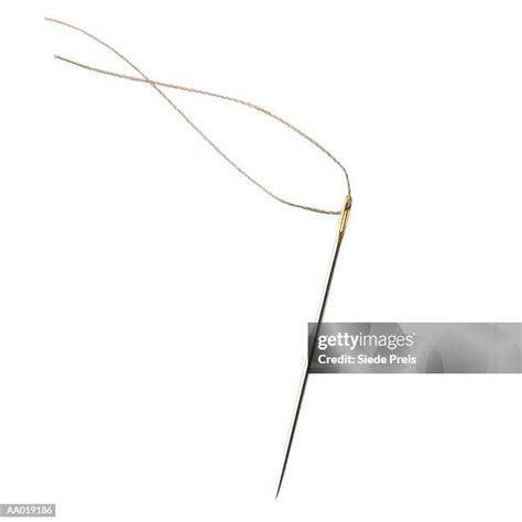Threading A Needle Closeup Photos And Premium High Res Pictures Getty