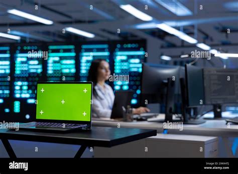 Focus On Green Screen Laptop In Data Center Facility Managing Rackmounts Energy Consumption