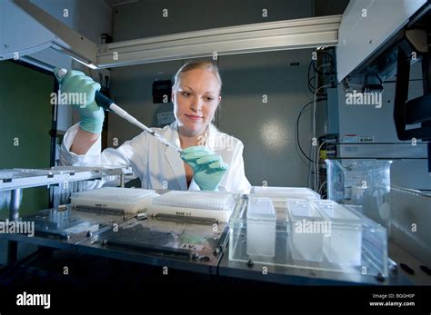 Female Laboratory Assistant Using Pipetting Robot Max Planck Institute