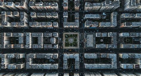 Aerial View Of A Cityscape Featuring Rectilinear Grid Patterns Of Streets And Buildings Stock