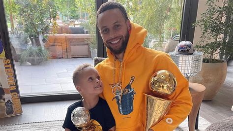 Steph Curry And Son Canon Cradle Nba Trophies After Warriors 4th