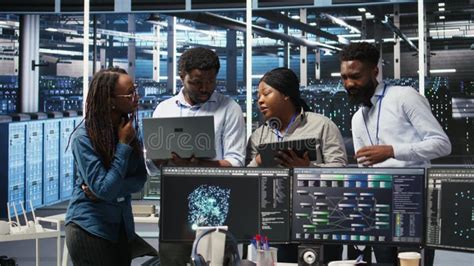 Portrait Of Smiling Data Center Specialists Collaborating In Server Facility Stock Video Video