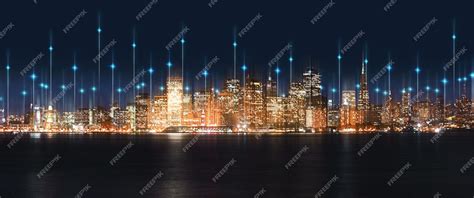 Premium Photo City Night And Skyline By Water With Tech Network Or Light Overlay For