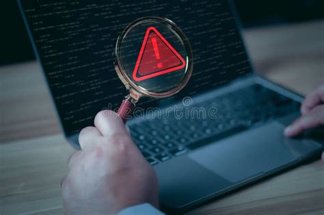 Hacker Or Programmer Using Laptop With Triangle Caution Warning Sign