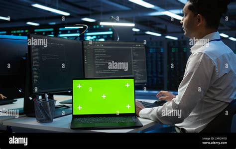 Admin In Data Center Using Isolated Screen Laptop To Design Implement