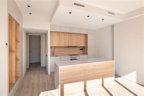 Light Modular Kitchen With Cupboard Design Interior Made In White And Light Brown Colors