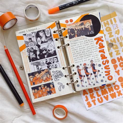 An Open Notebook With Orange And White Designs On It Next To Markers Tape Scissors And Other Items