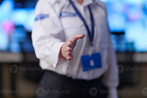Female Security Operator Extending A Hand For A Handshake 10701515