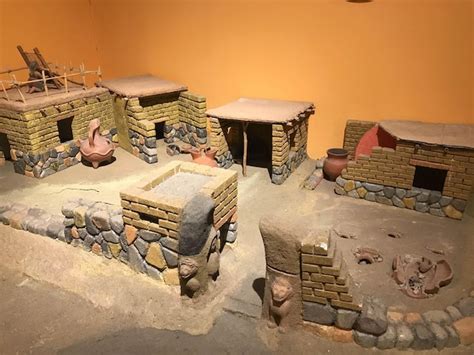 Premium Photo A Small Clay Model Of An Ancient Building In A Museum