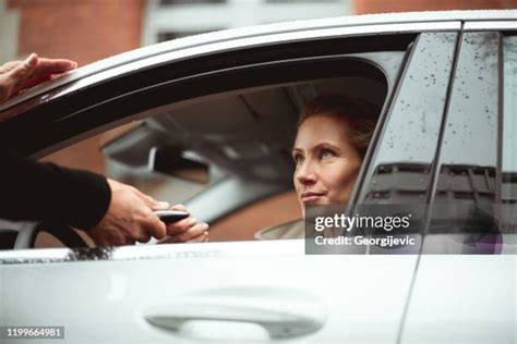 Hands Passing Keys Photos And Premium High Res Pictures Getty Images