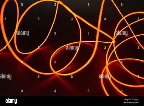 Unusual Glowing Background Of Chaotically Stacked Thin Light Wires Red Glowing Tourniquet